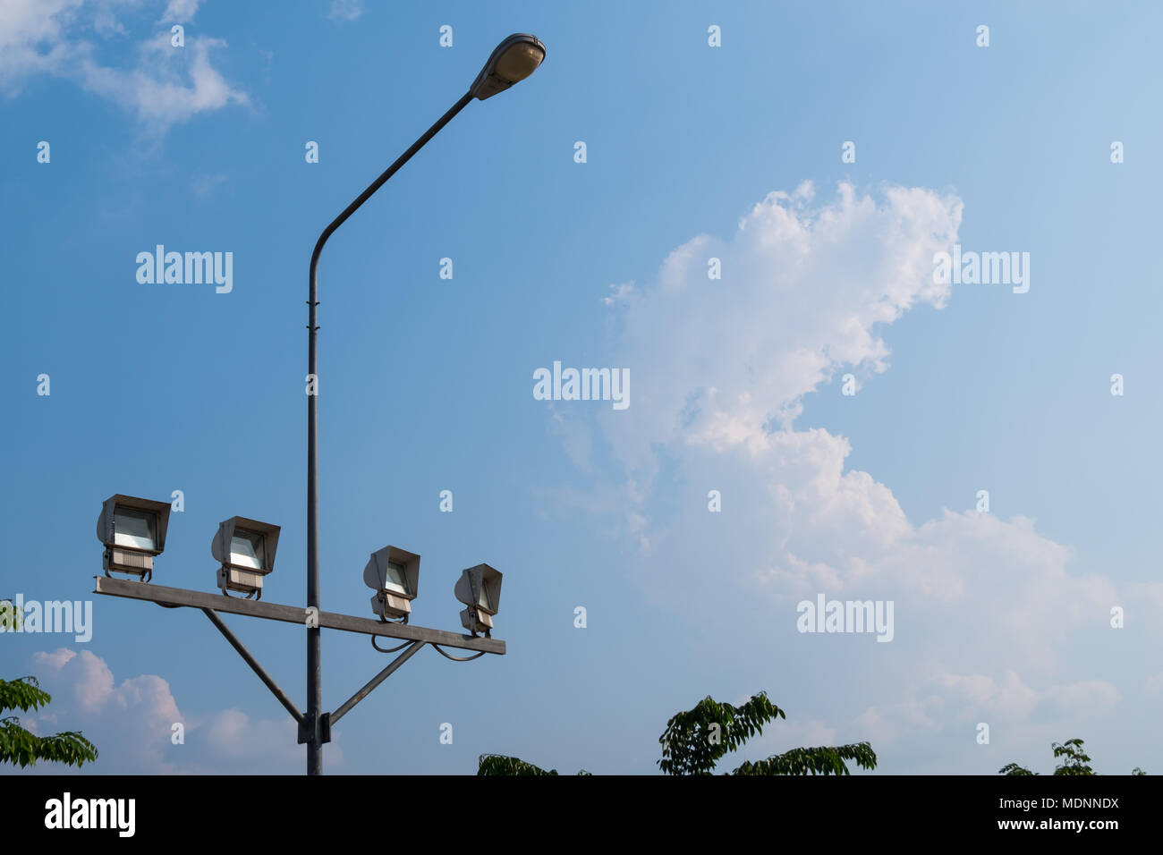 Spotlight. Pillar spotlights on blue sky background Stock Photo - Alamy