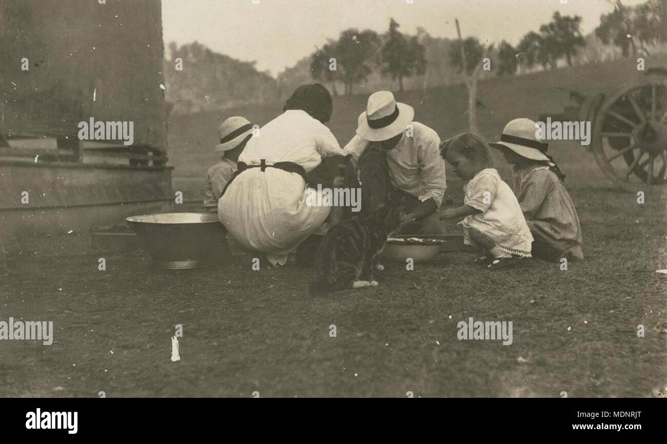 Stehbens family members cleaning chickens at Monsildale, Queensland ...