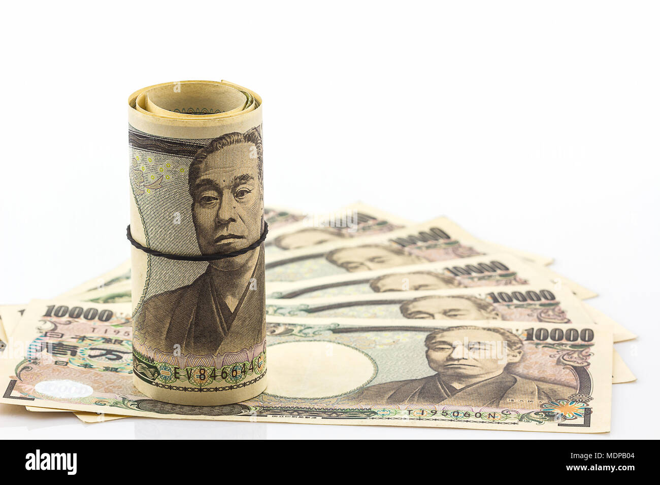 Japanese Yen banknotes on white background Stock Photo - Alamy