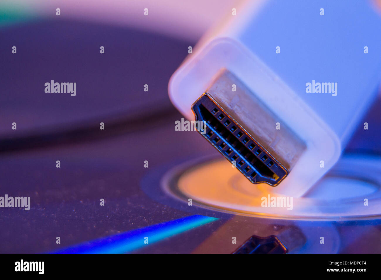 Closeup of white HDMI cable with it's reflection on blank disc Stock ...