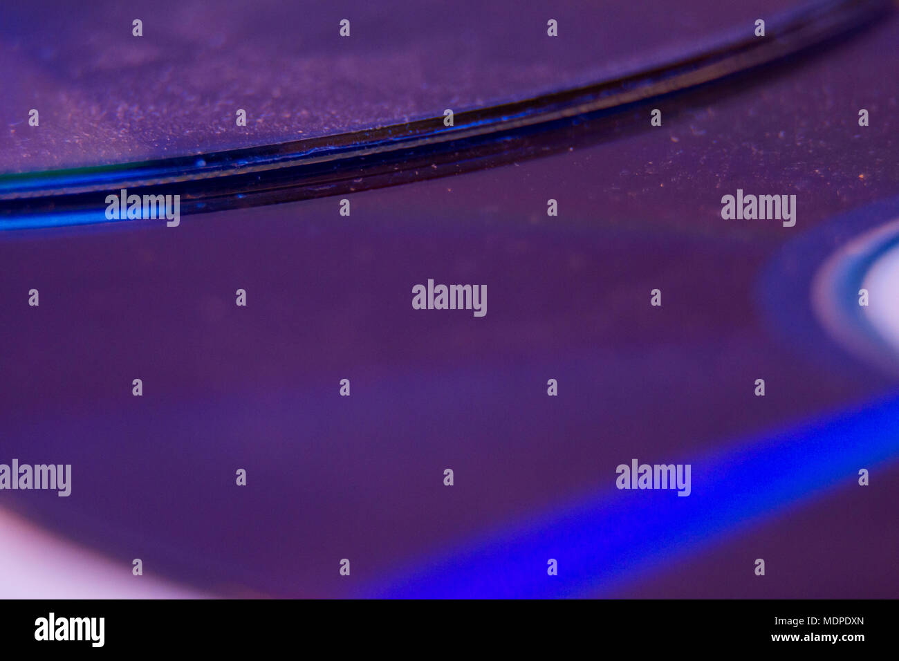 Macro closeup of Compact CD or DVD disc in violet color Stock Photo - Alamy