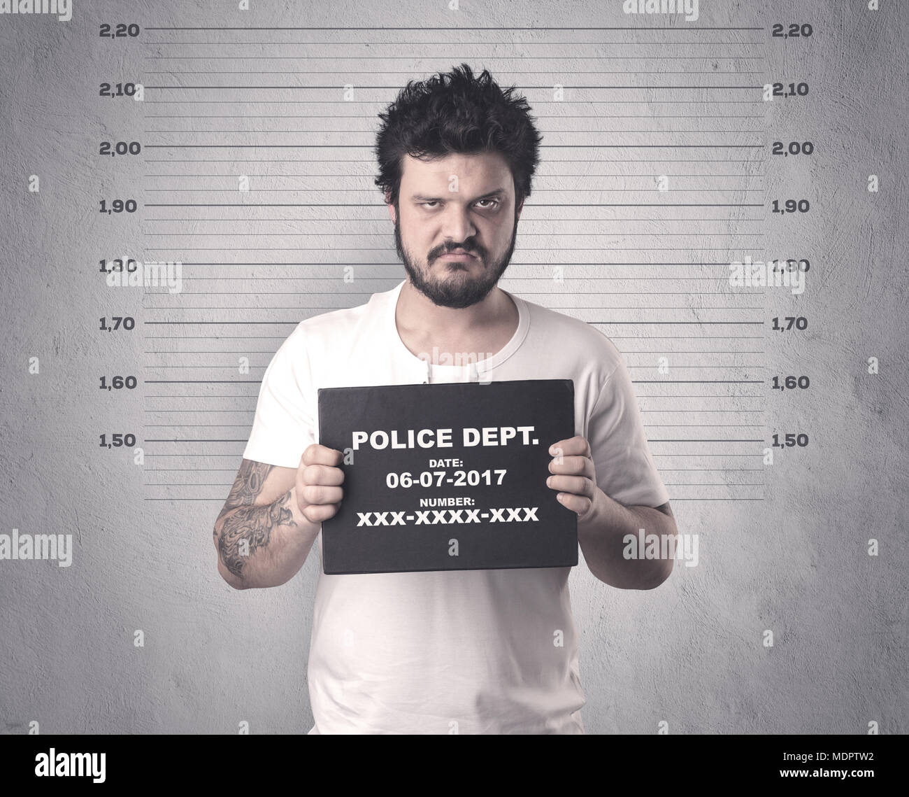 Caught gangster in jail with table on his hand Stock Photo - Alamy