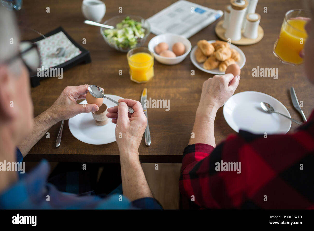 Back portrait of senior people eating breakfast together Stock Photo ...