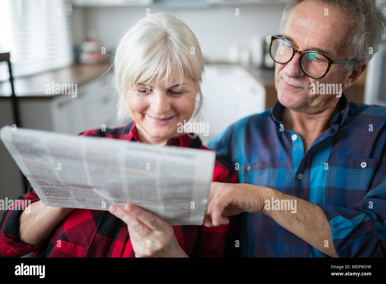 Reading newspaper together hi-res stock photography and images - Alamy