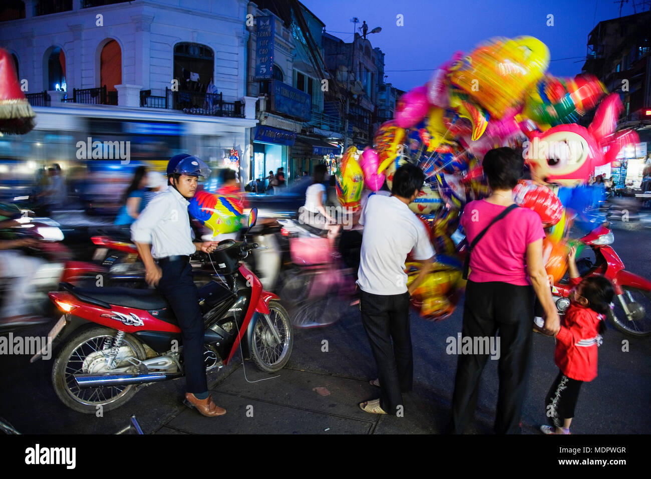 Hanoi, Vietnam; Man selling balloons in Hang Dao Stock Photo - Alamy