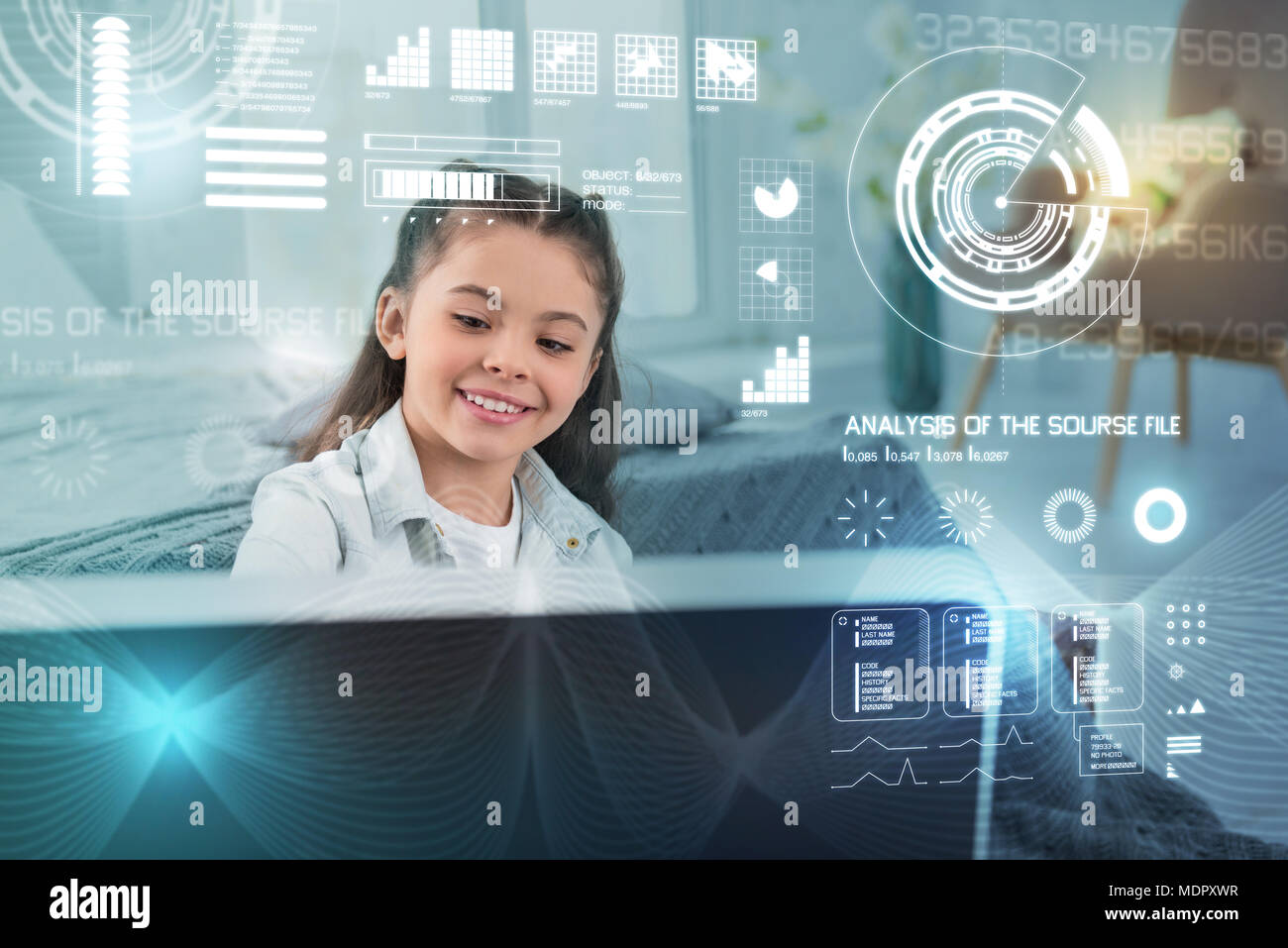 Smiling child looking at the big computer and smiling happily Stock ...