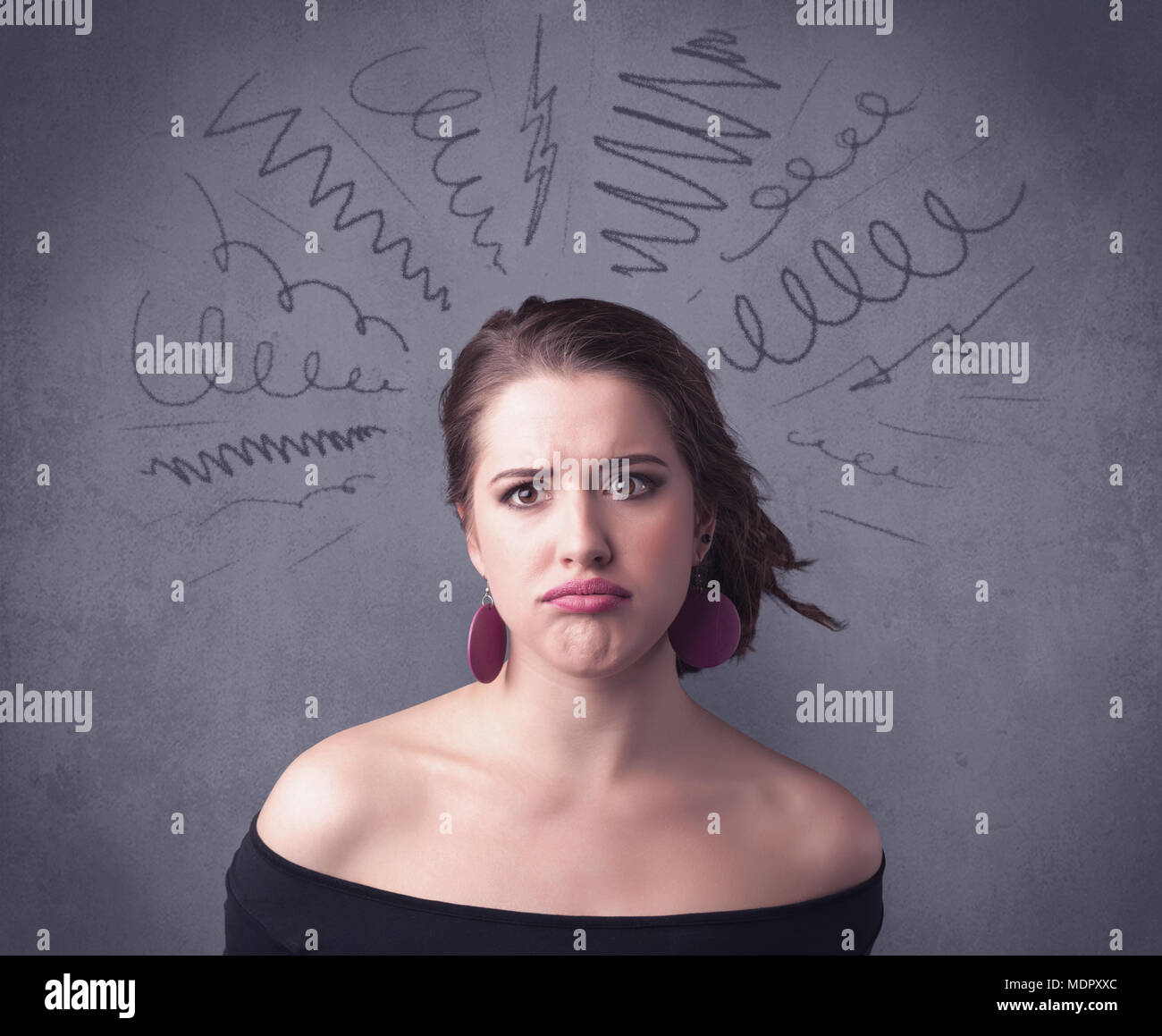 A cute female student making funny face expressions with pressure and ...