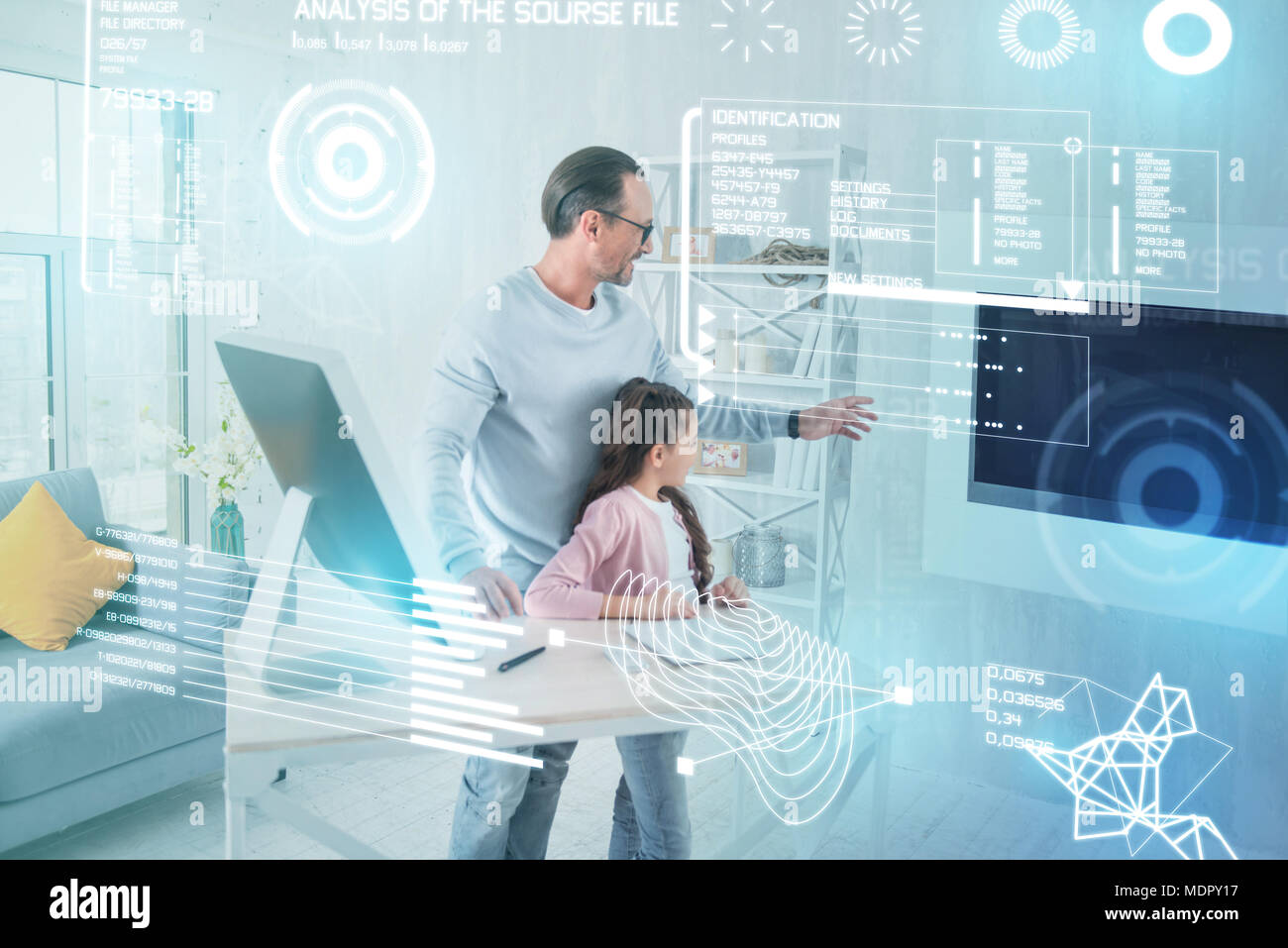 Professional programmer smiling while showing his child a new creation ...