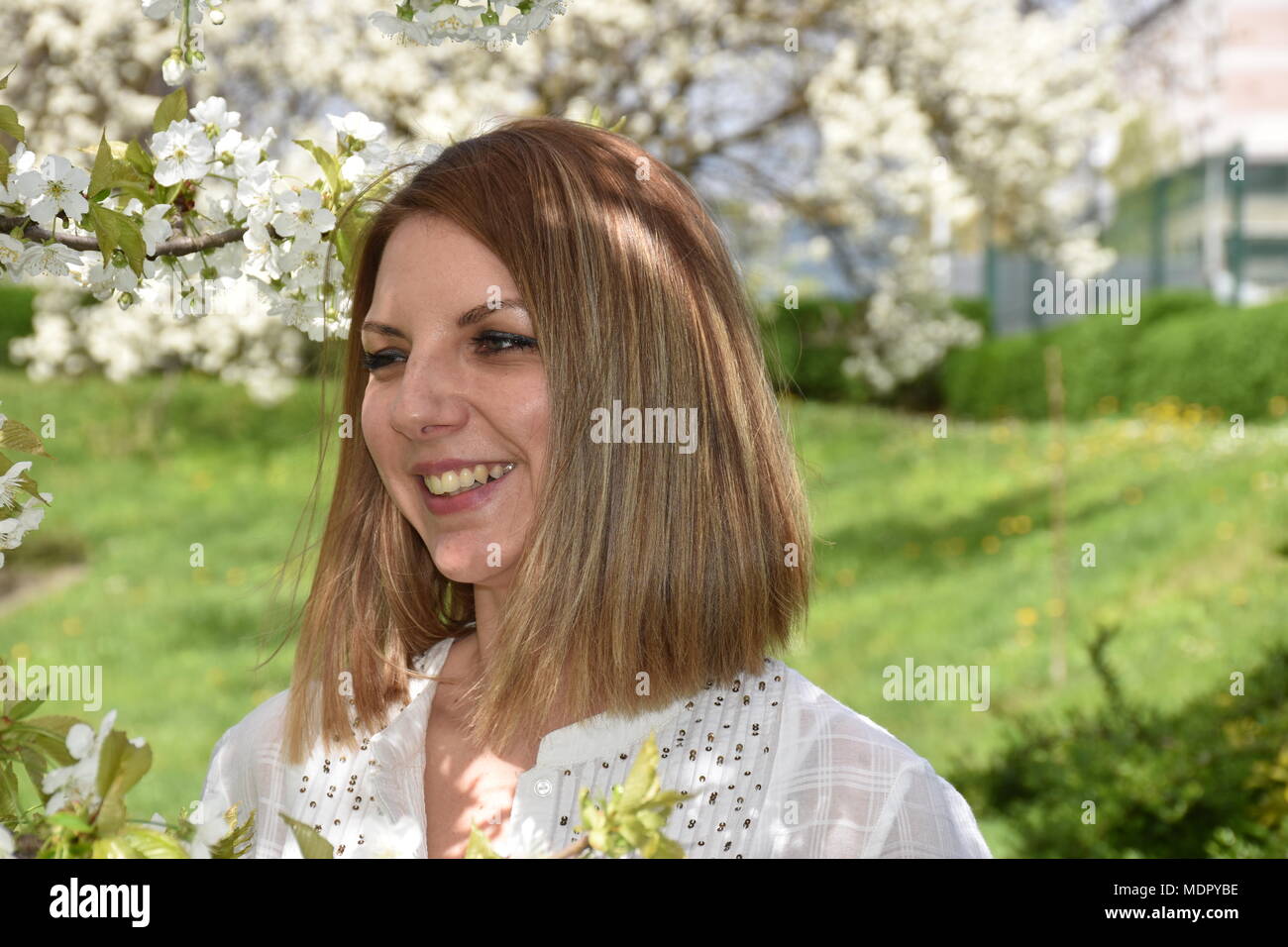 Young woman white blossom hi-res stock photography and images - Alamy