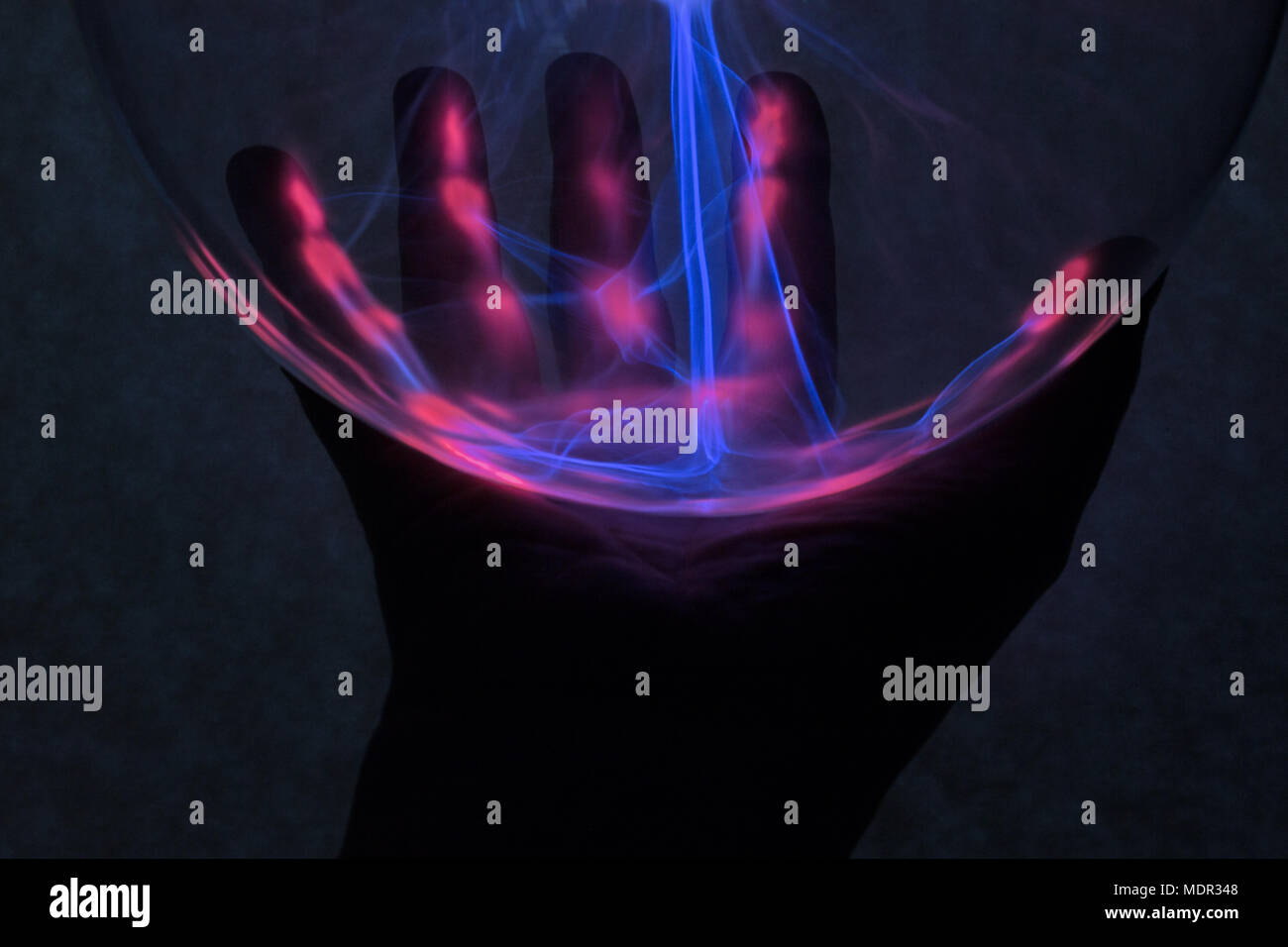 In the background is the hand that was illuminated by plasma from ...