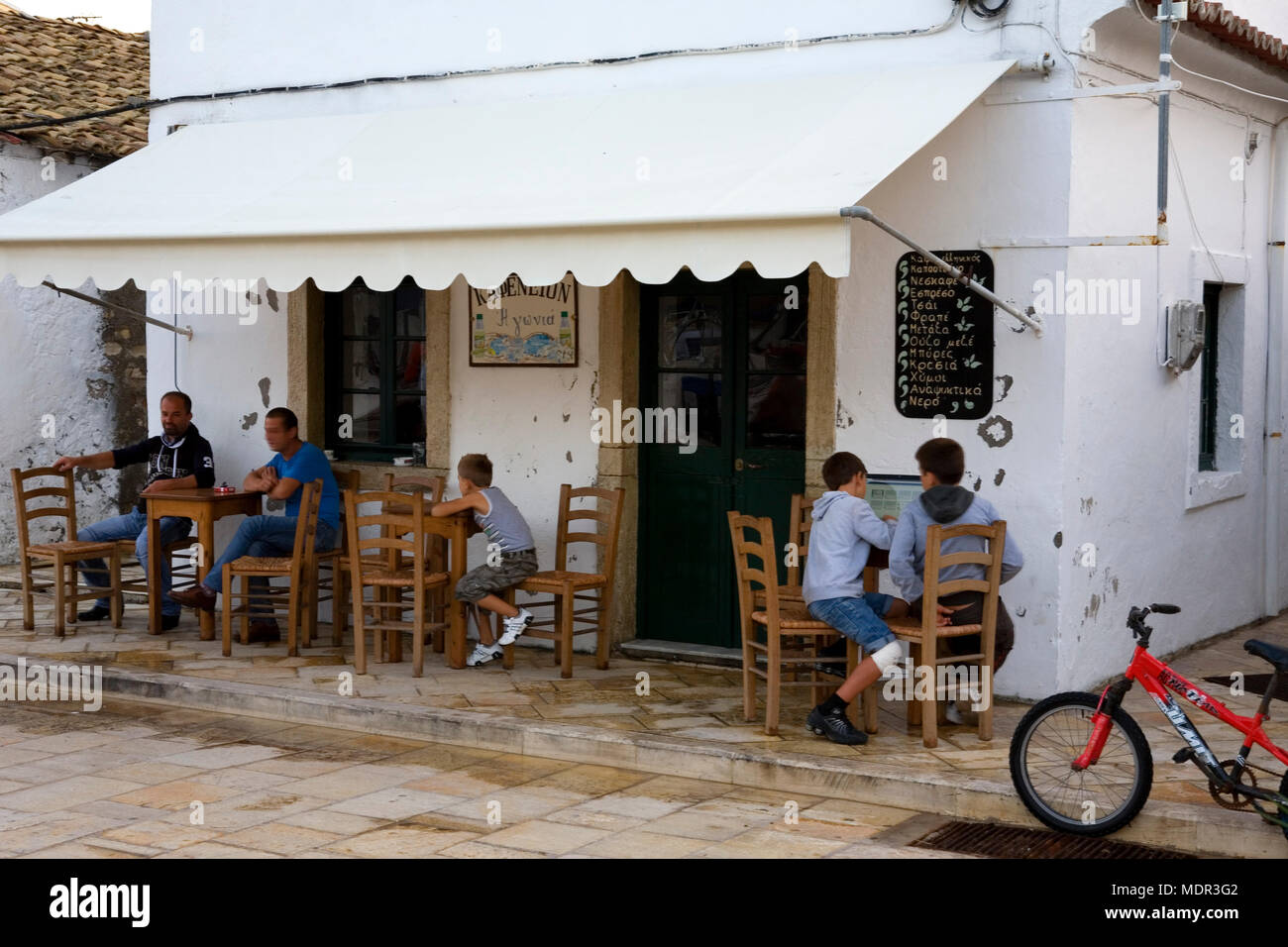 Locals relaxing in a backstreet kafenion, Gaios, Paxos, Greece Stock ...