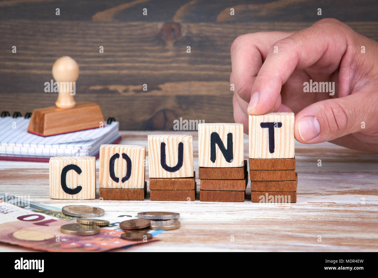 Count concept. Wooden letters on the office desk, informative and ...