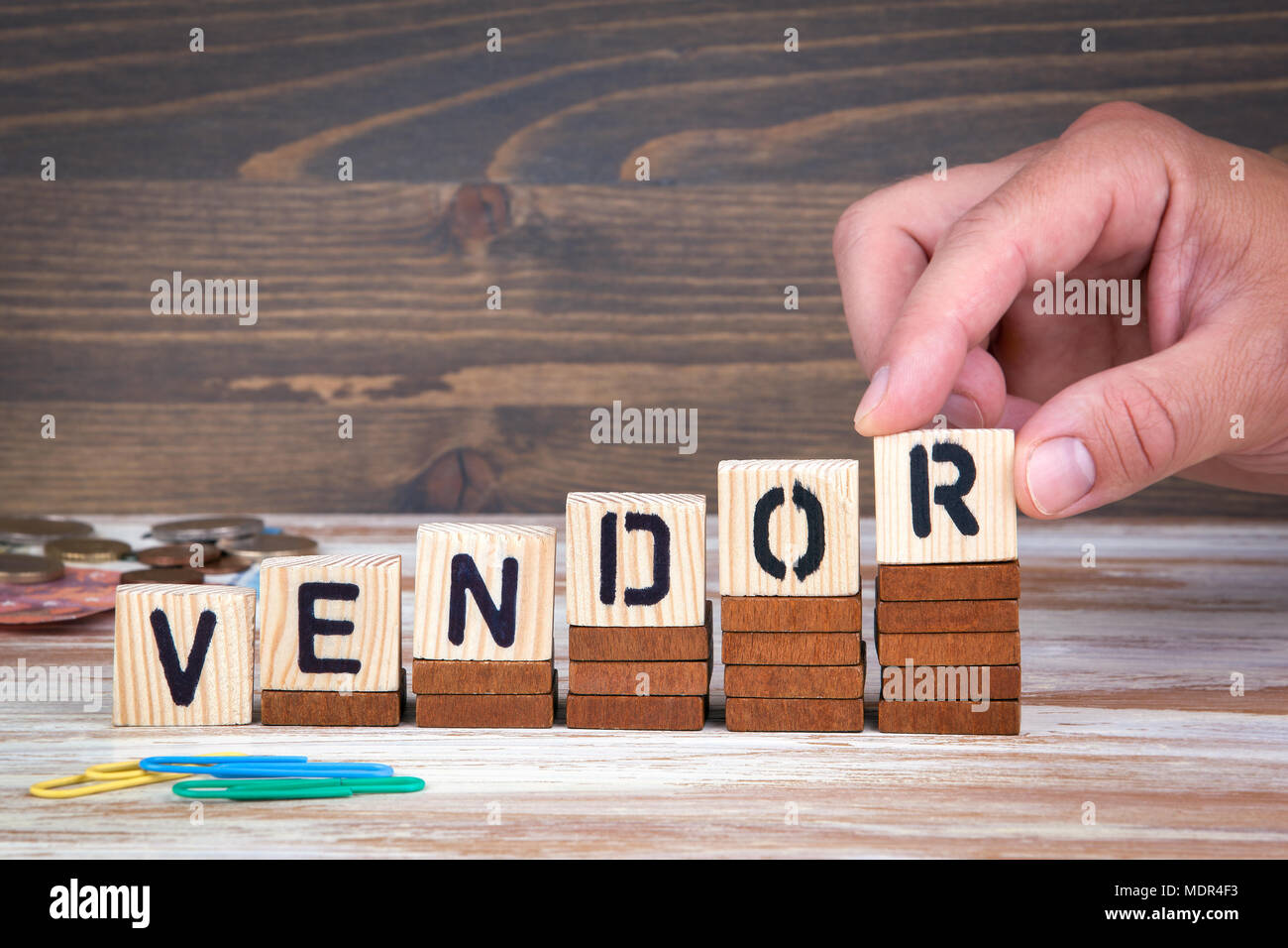 Vendor concept. Wooden letters on the office desk, informative and ...