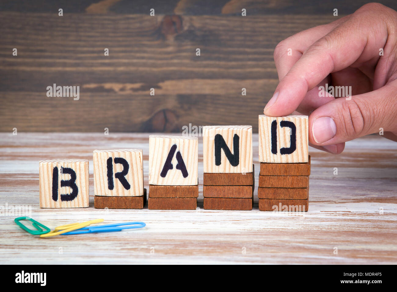 Brand concept. Wooden letters on the office desk, informative and ...
