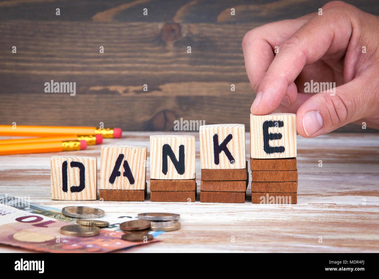 Danke concept. Wooden letters on the office desk, informative and ...