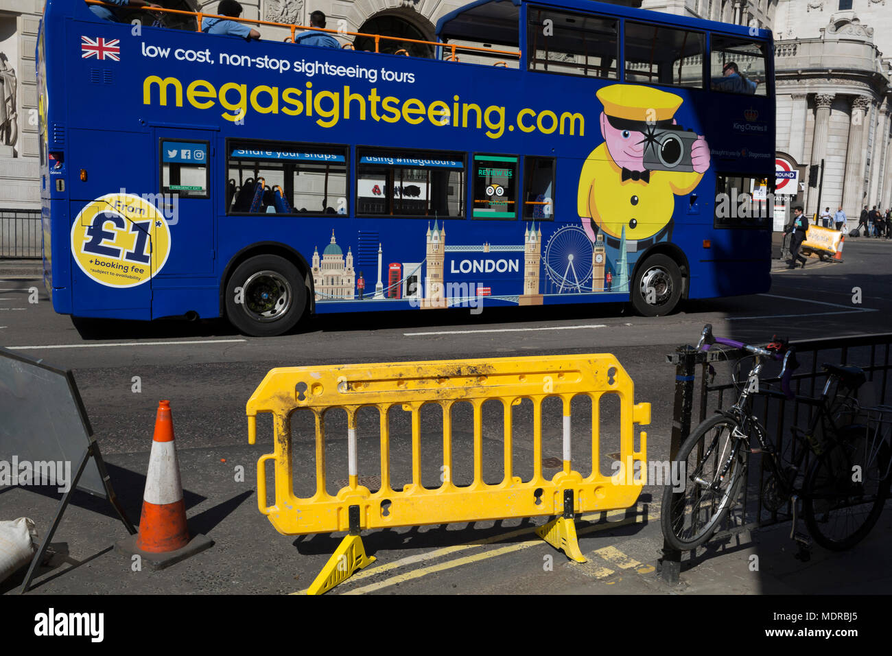 A London sightseeing bus passes through Bank Triangle in the City of ...