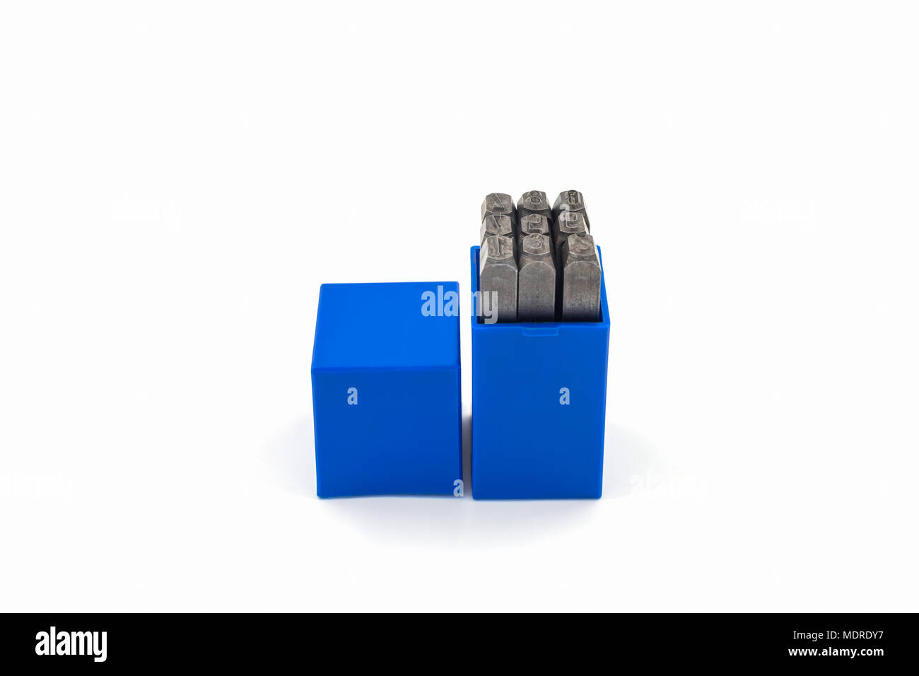 The metal lettering stamps punch set in a plastic box on the white ...
