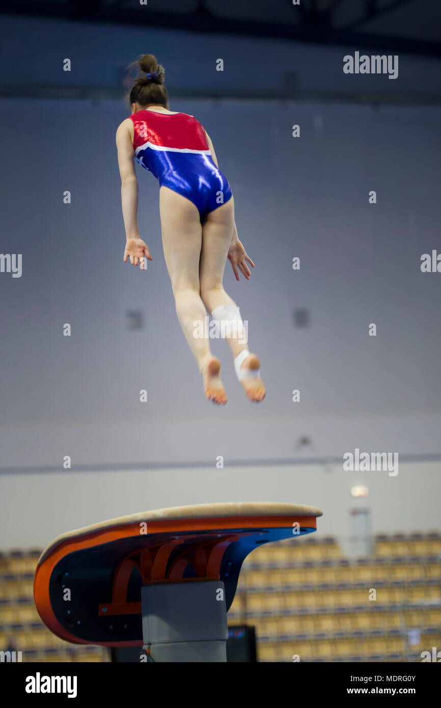 Female athlete gymnast performing a leap at the championship Stock ...