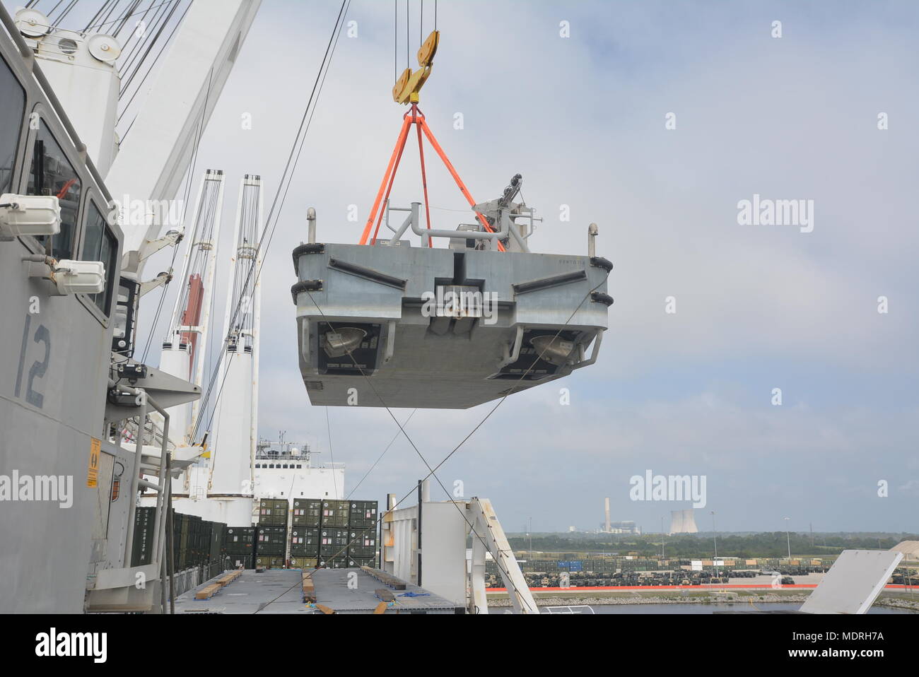 The warping tug is being placed on top of an intermediate module on the ...