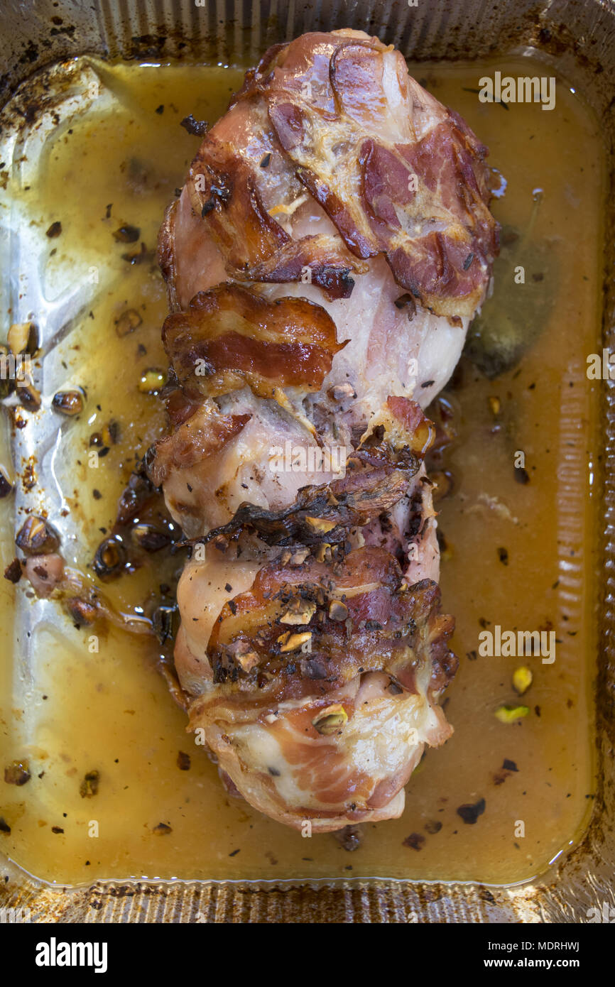 roasted bacon-wrapped rabbit in a metallic tray Stock Photo - Alamy