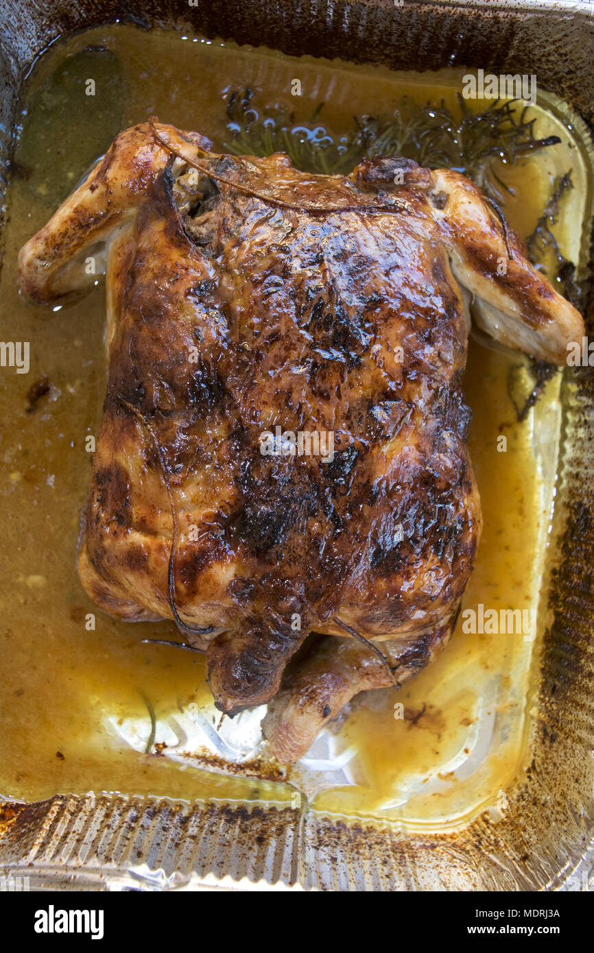 roasted take away rotisserie chicken packagen in metallic tray Stock ...