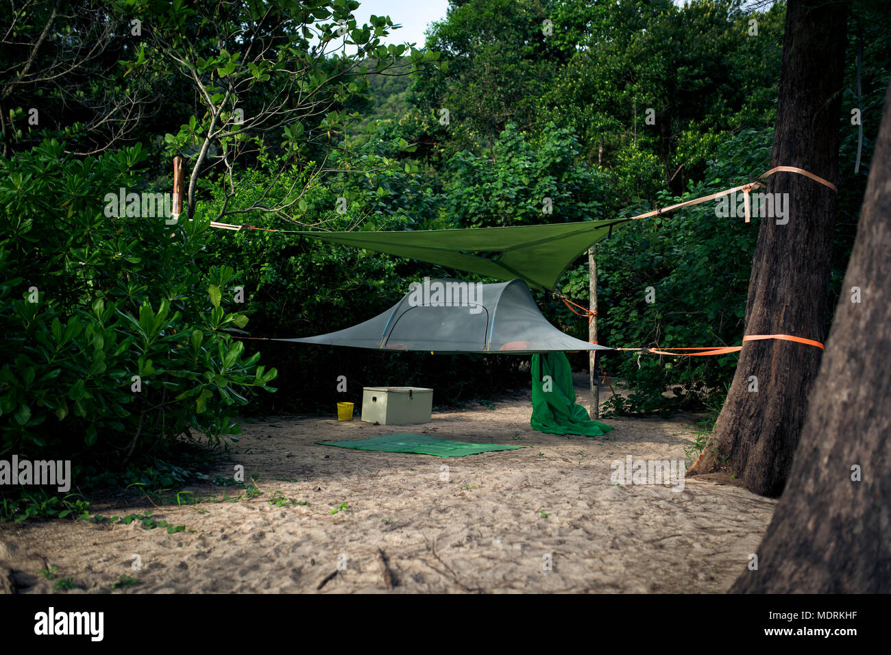 Modern tourist tent hanging between trees at the beach. Koh Rong ...