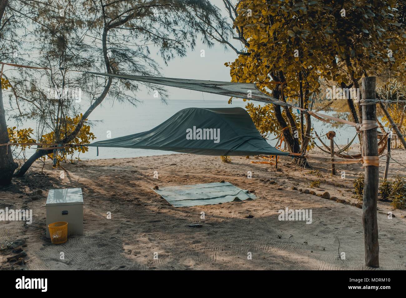 Modern tourist tent hanging between trees at the beach. Koh Rong ...