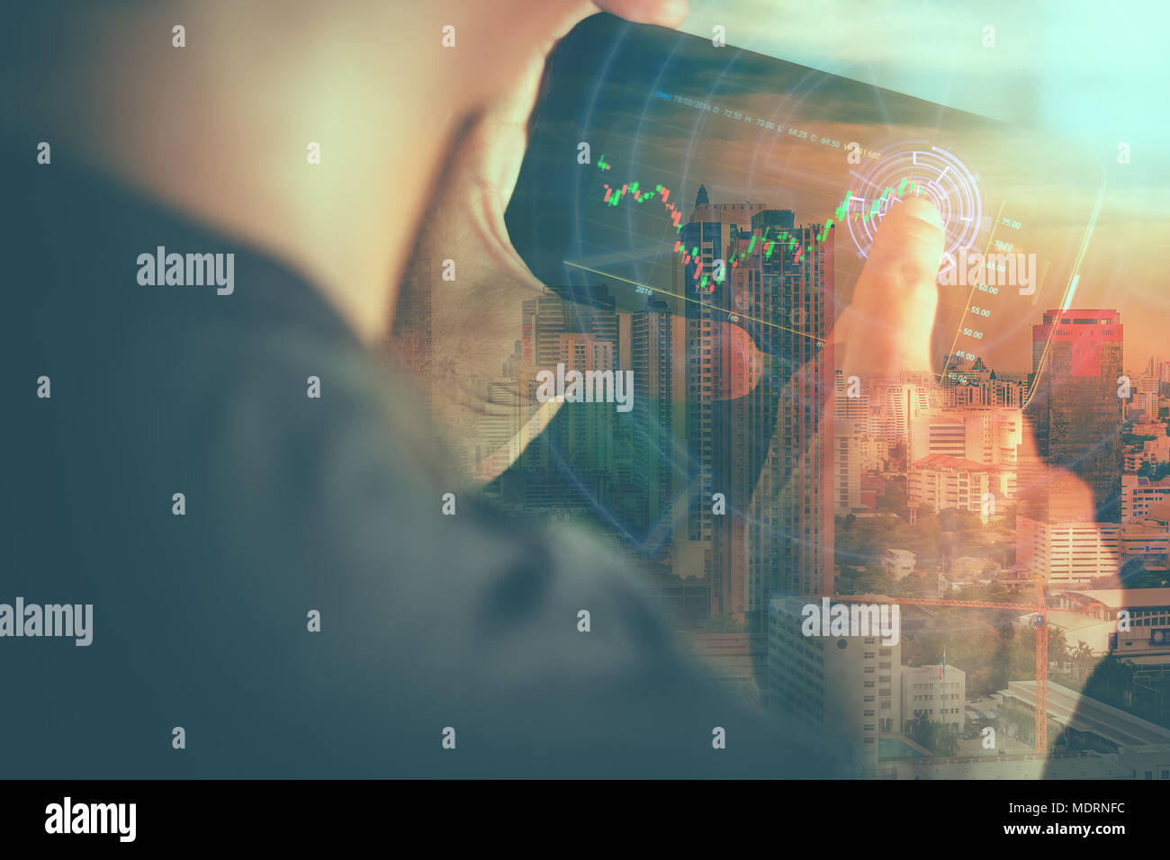 a man checking stock market on tablet. double exposure, close up ...