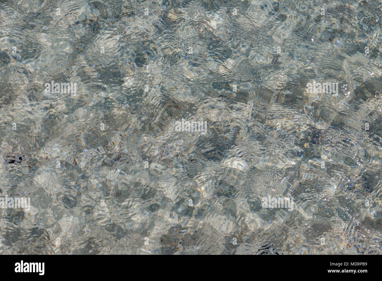 Tropical transparent sea water with sun light reflections Stock Photo ...
