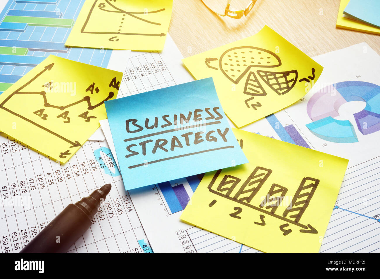 Business strategy and financial graphs and charts Stock Photo - Alamy
