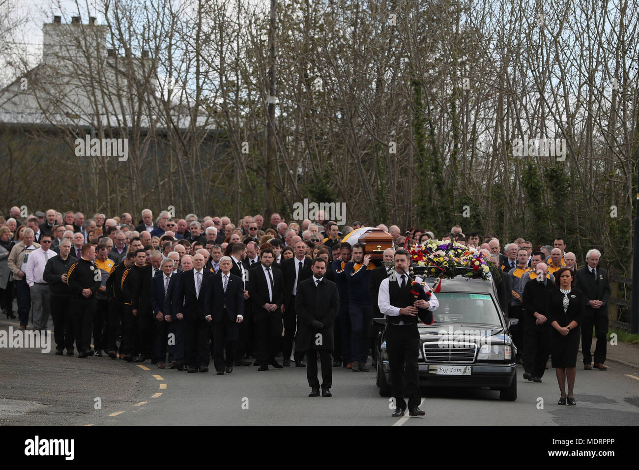 The funeral cortege makes it way to Saint Patrick's Church in Oram ...