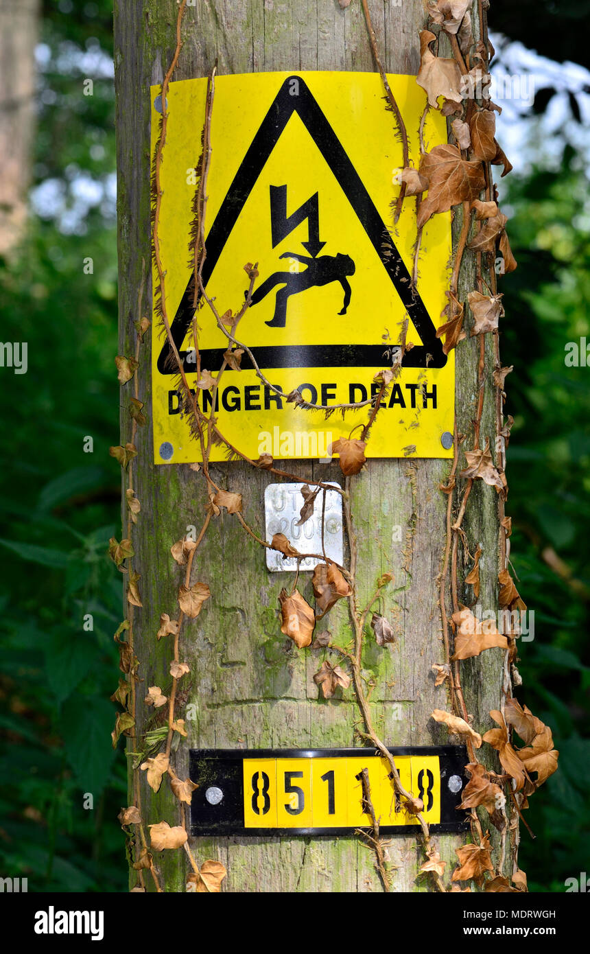 Warning sign on electricity pole hi-res stock photography and images ...