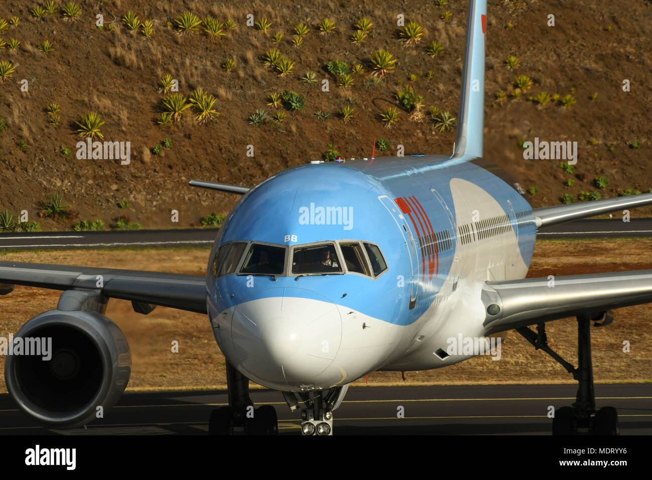 Close up of a TUI Boeing 757 passenger jet turning onto its parking ...