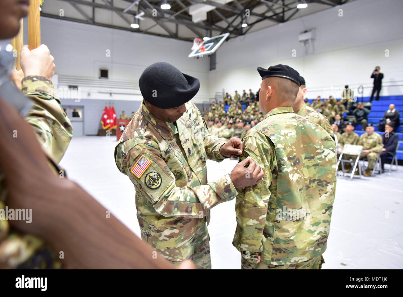 CAMP CASEY, Republic of Korea--Command Sgt. Maj. Edward Mitchell places ...