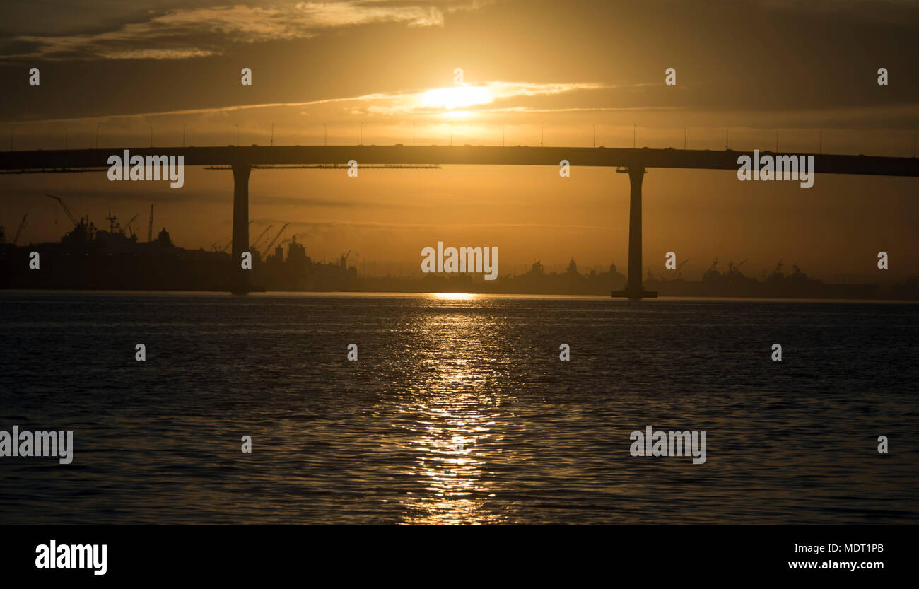 171201-N-PP996-104 SAN DIEGO (Dec. 1, 2017)--The sun rises behind ships ...