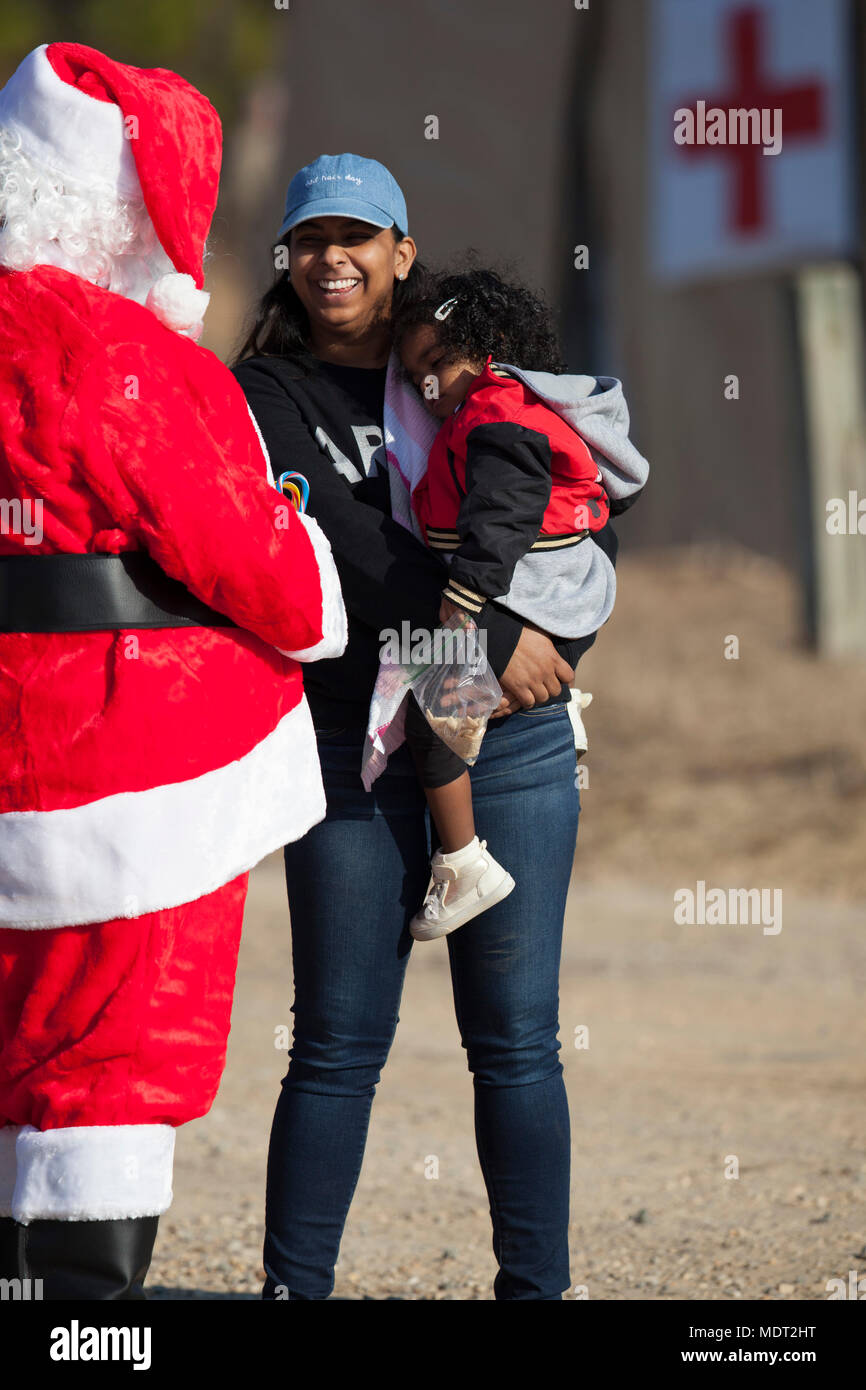 Children anxiously await the arrival of Santa Claus as he walks off the ...