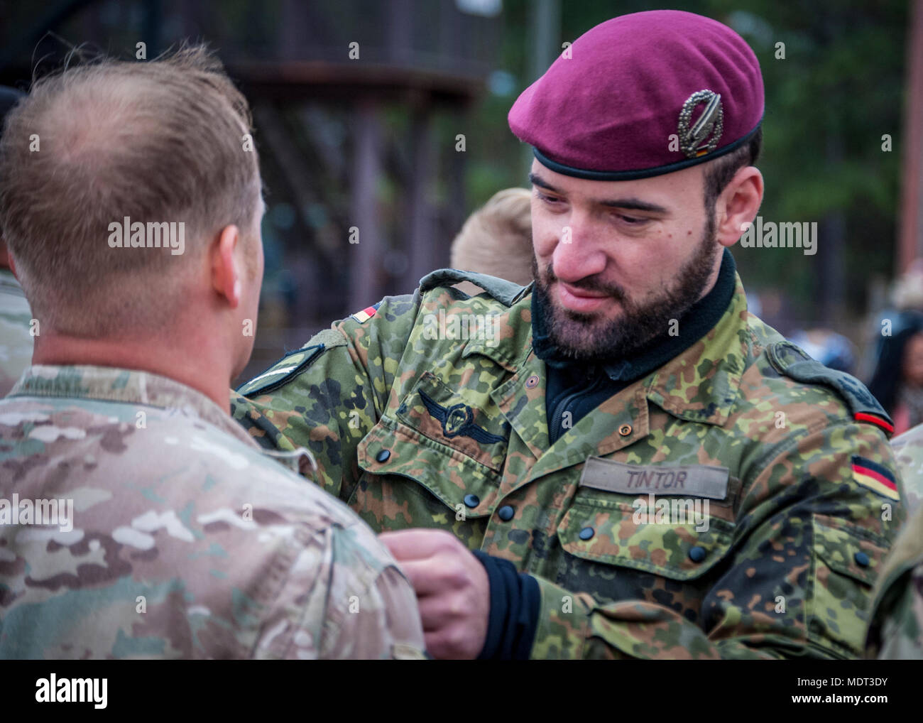 German Lt. Col. Tintor awards a U.S. Soldier his county's jump wings ...