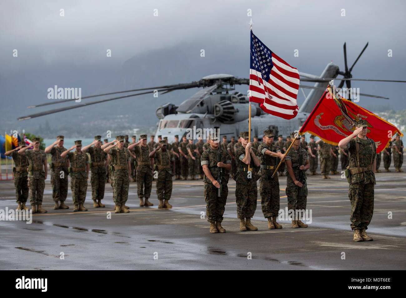 U.S. Marines with Marine Heavy Helicopter Squadron 463 salute for the ...