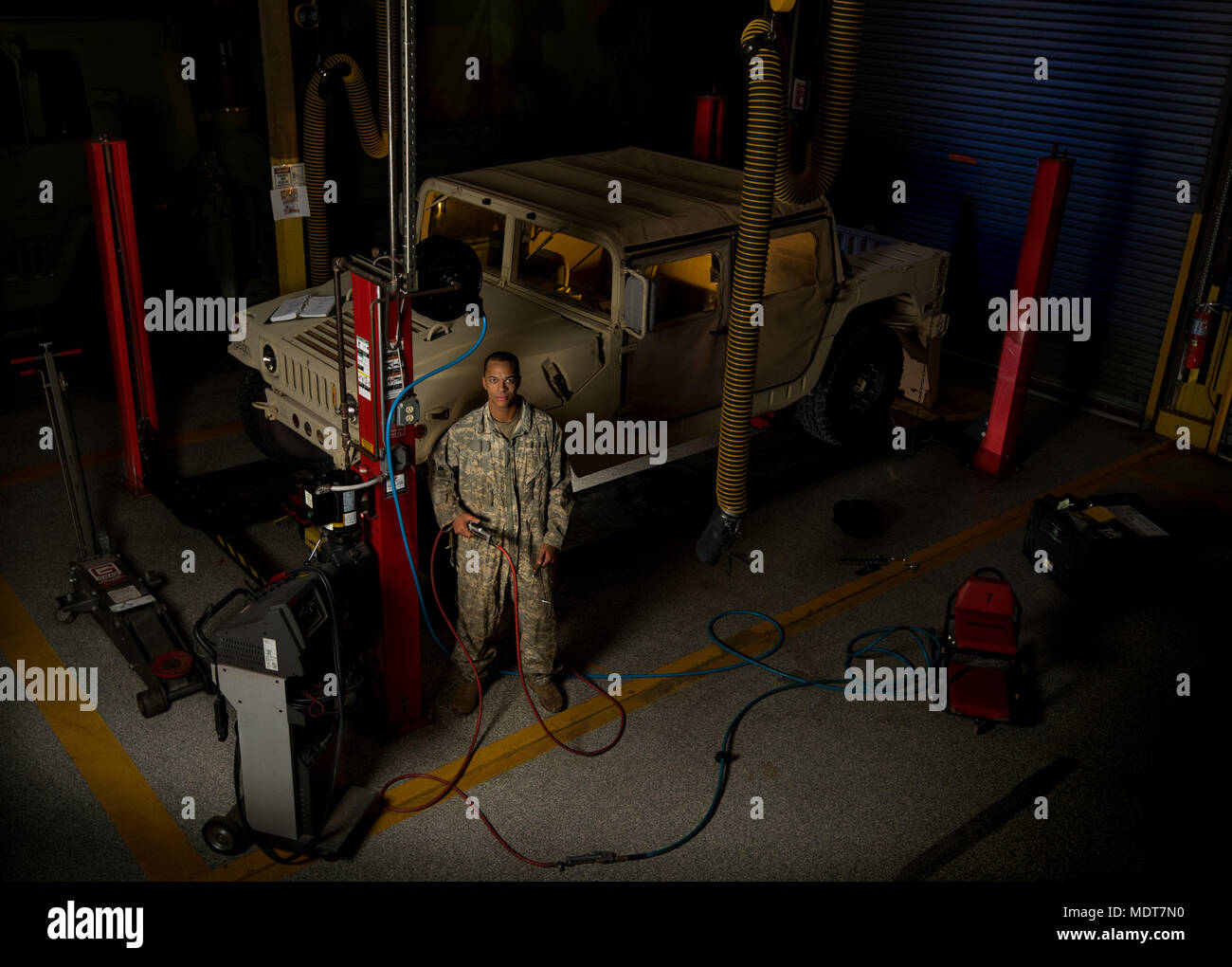 U.S. Army Sgt. Samuel Nobles, a Wheeled Vehicle Mechanic assigned to ...