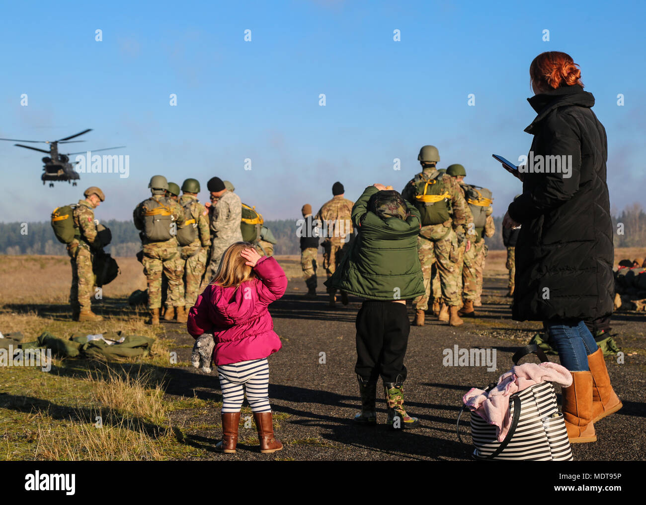 Family members of 1st Special Forces Group (Airborne) watch a Chinook ...