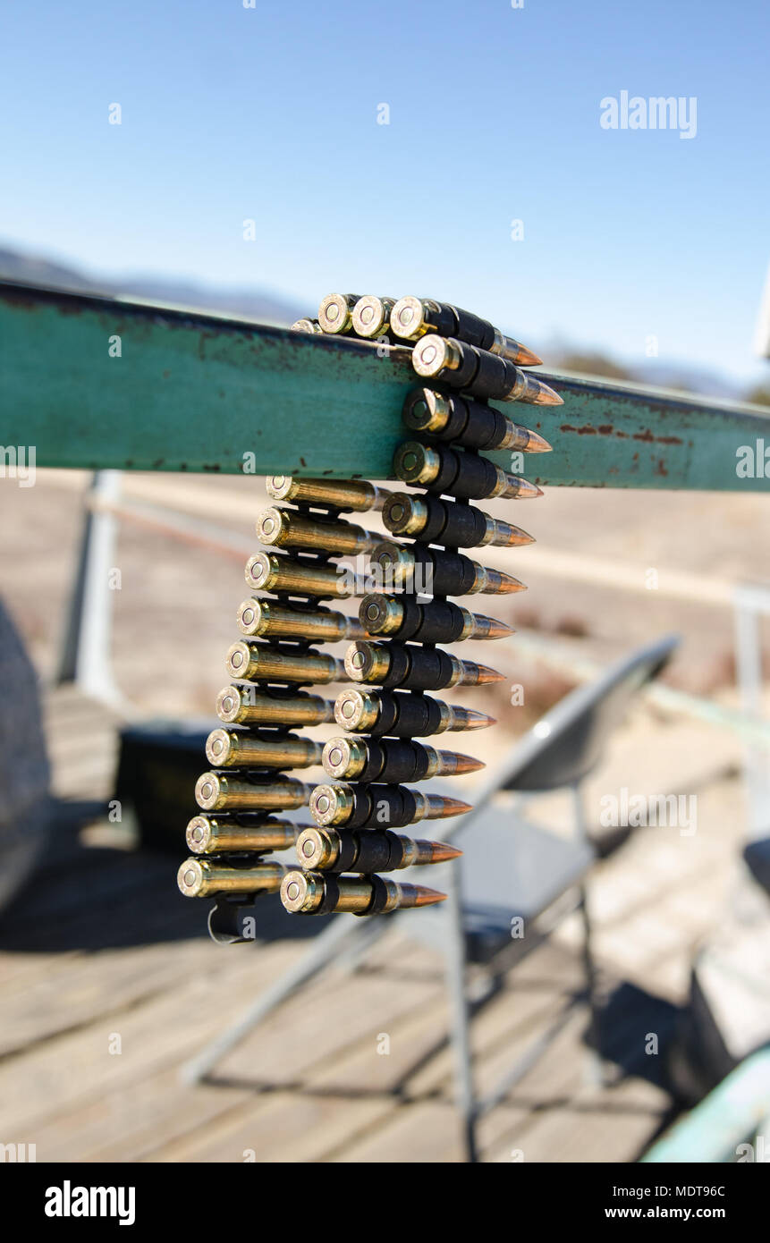 Ammunition for an M240B machine gun lays on a bar while U.S. Army ...