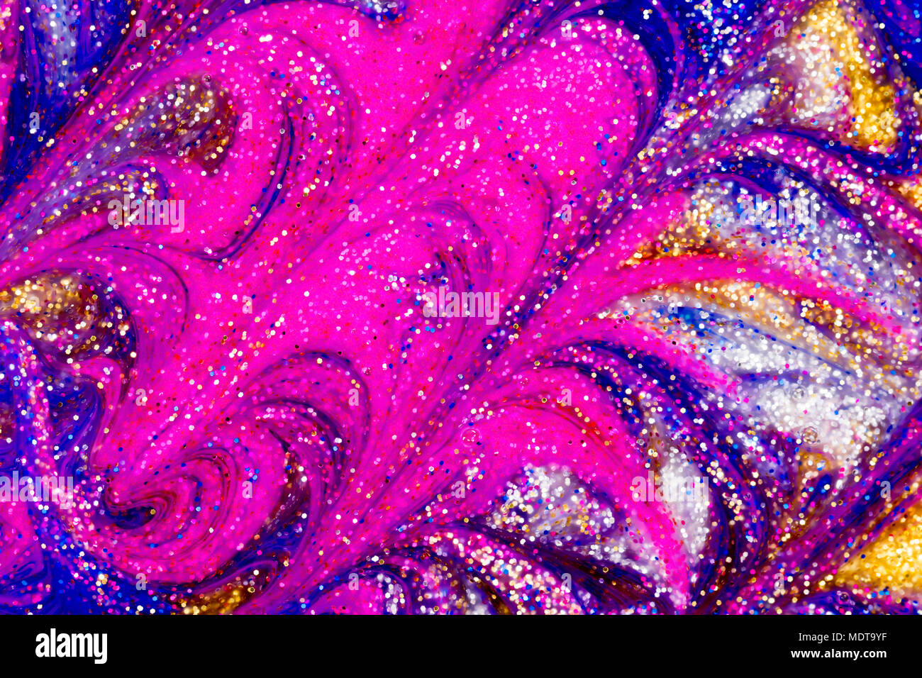 Abstract silver gold pink and blue liquid glitter paint swirl ...