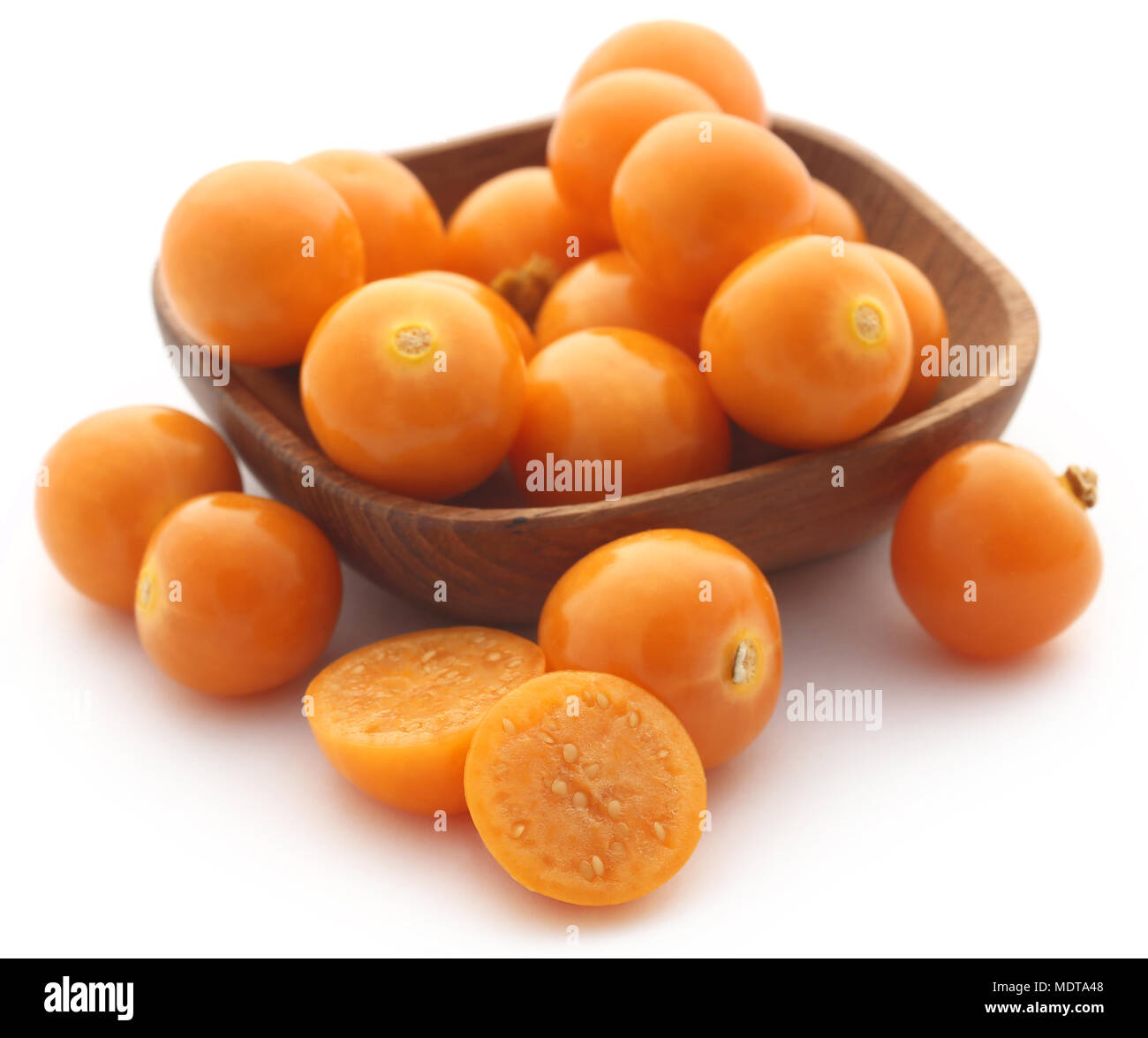 Fresh edible physalis in a bowl over white background Stock Photo - Alamy