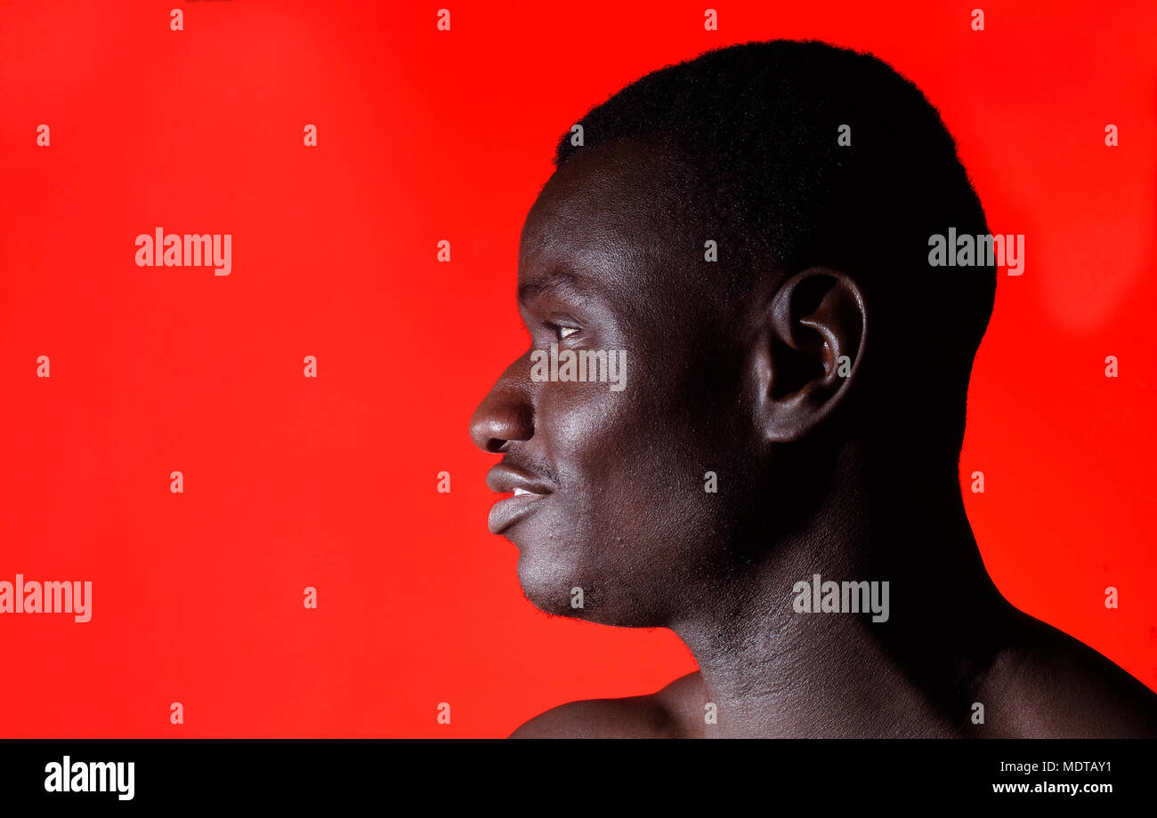 african man on red Stock Photo - Alamy
