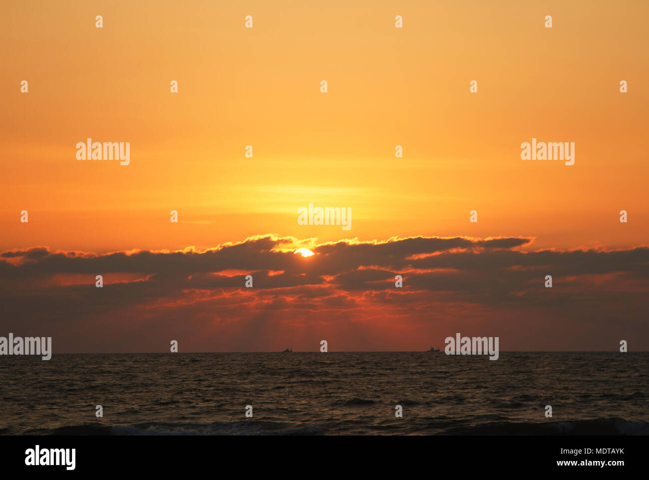 Beautiful sunset on sea ships hi-res stock photography and images - Alamy