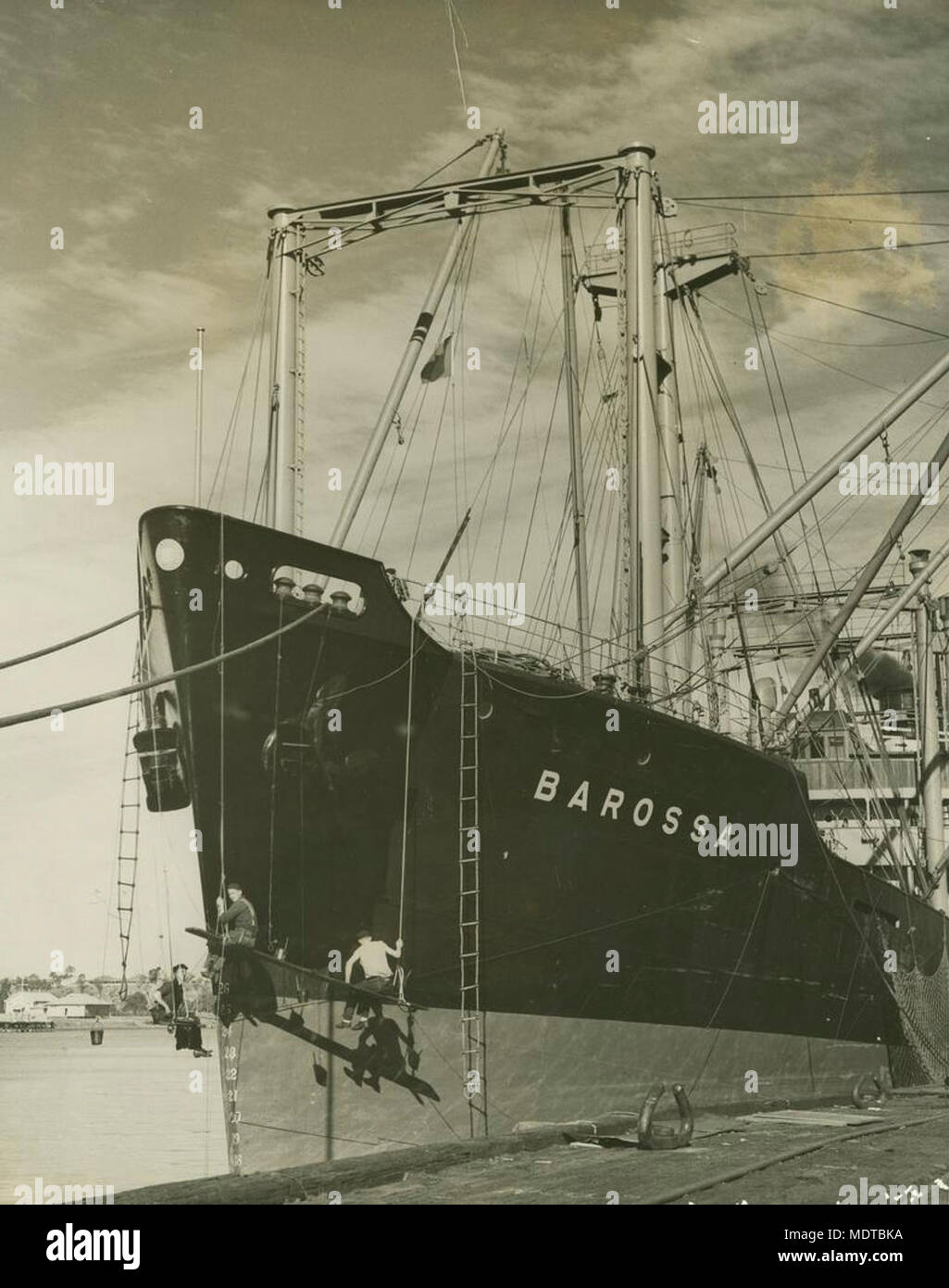 Men working on the cargo ship Barossa while in port. Location: Brisbane ...