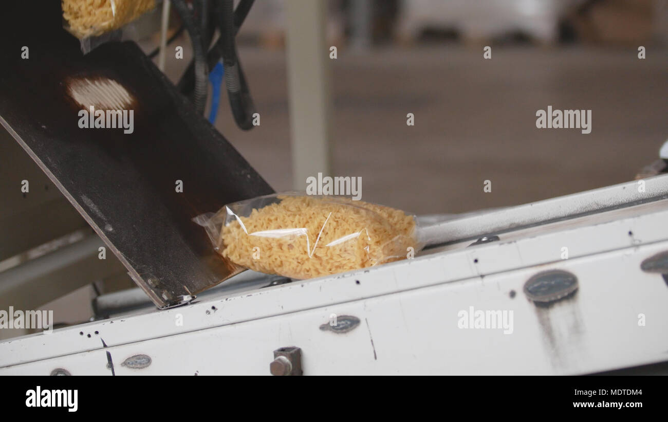 Packed macaroni on a production line in a pasta manufactury Stock Photo ...