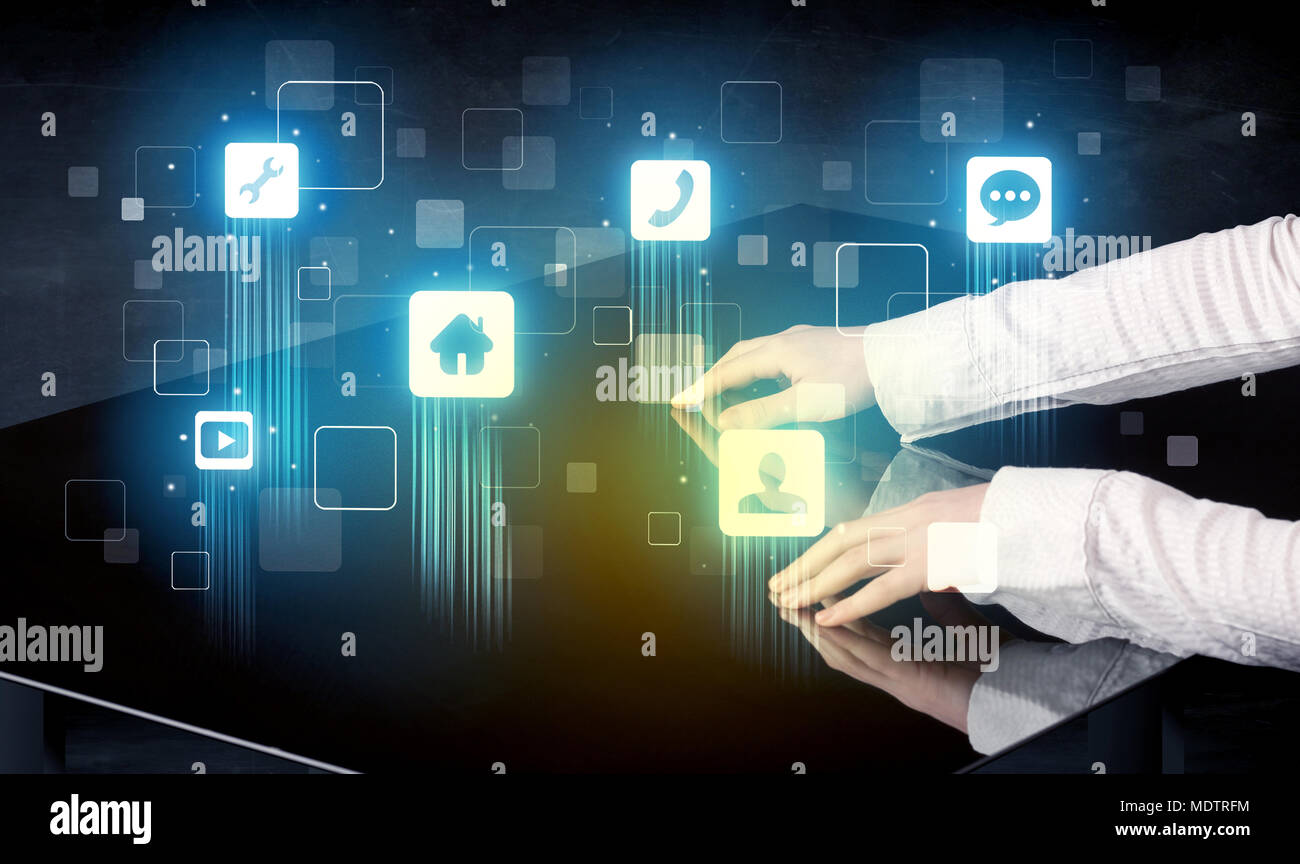 Modern smart table with high tech icons on its interface screen concept ...