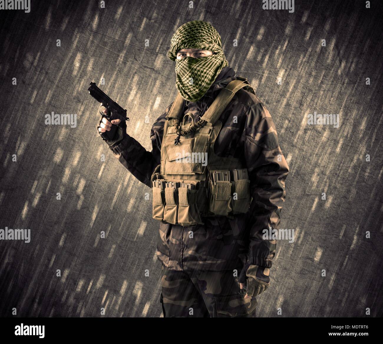 Close up of an armed terrorist man with mask on rainy background Stock ...