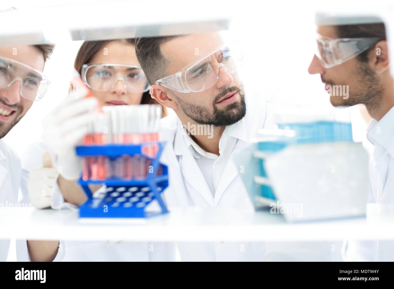 closeup of a group of scientists and pharmacists in the laboratory ...